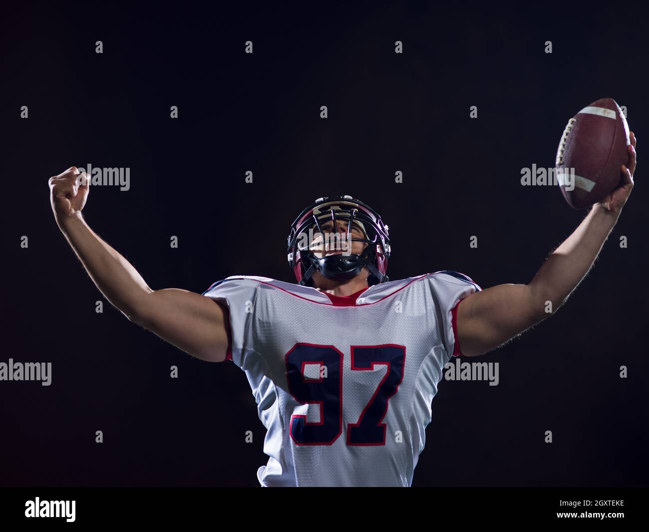 american football player celebrating after scoring a touchdown on field ...