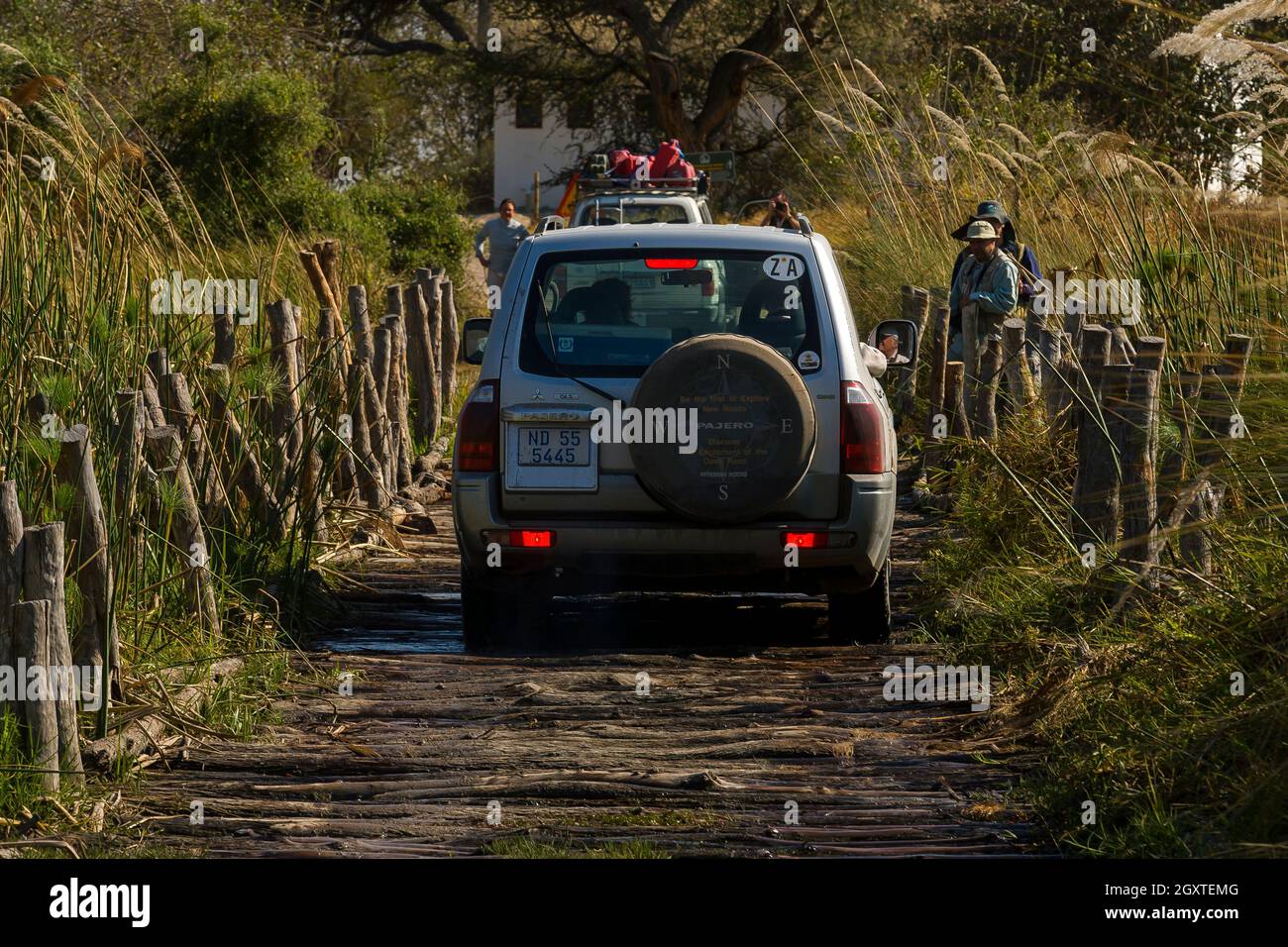 Safari car crossing the popular Third Bridge, Moremi Game Reserve ...