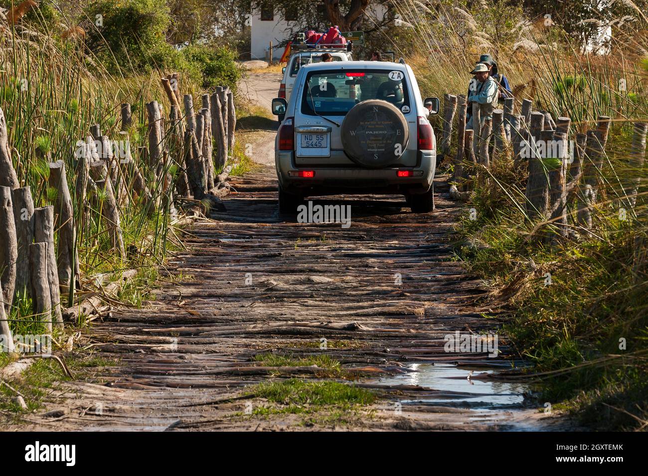 Safari car crossing the popular Third Bridge, Moremi Game Reserve ...