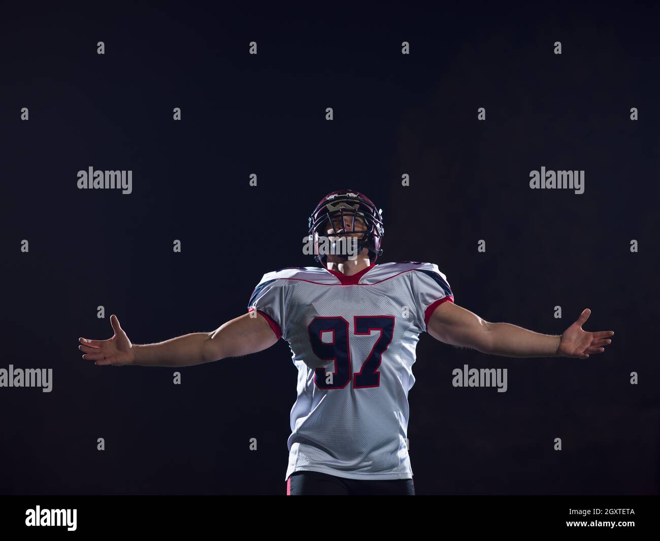 american football player celebrating after scoring a touchdown on field ...