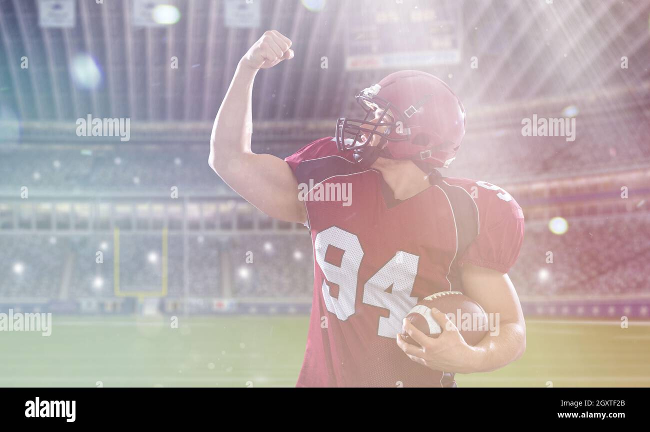 american football player celebrating touchdown on big modern stadium ...