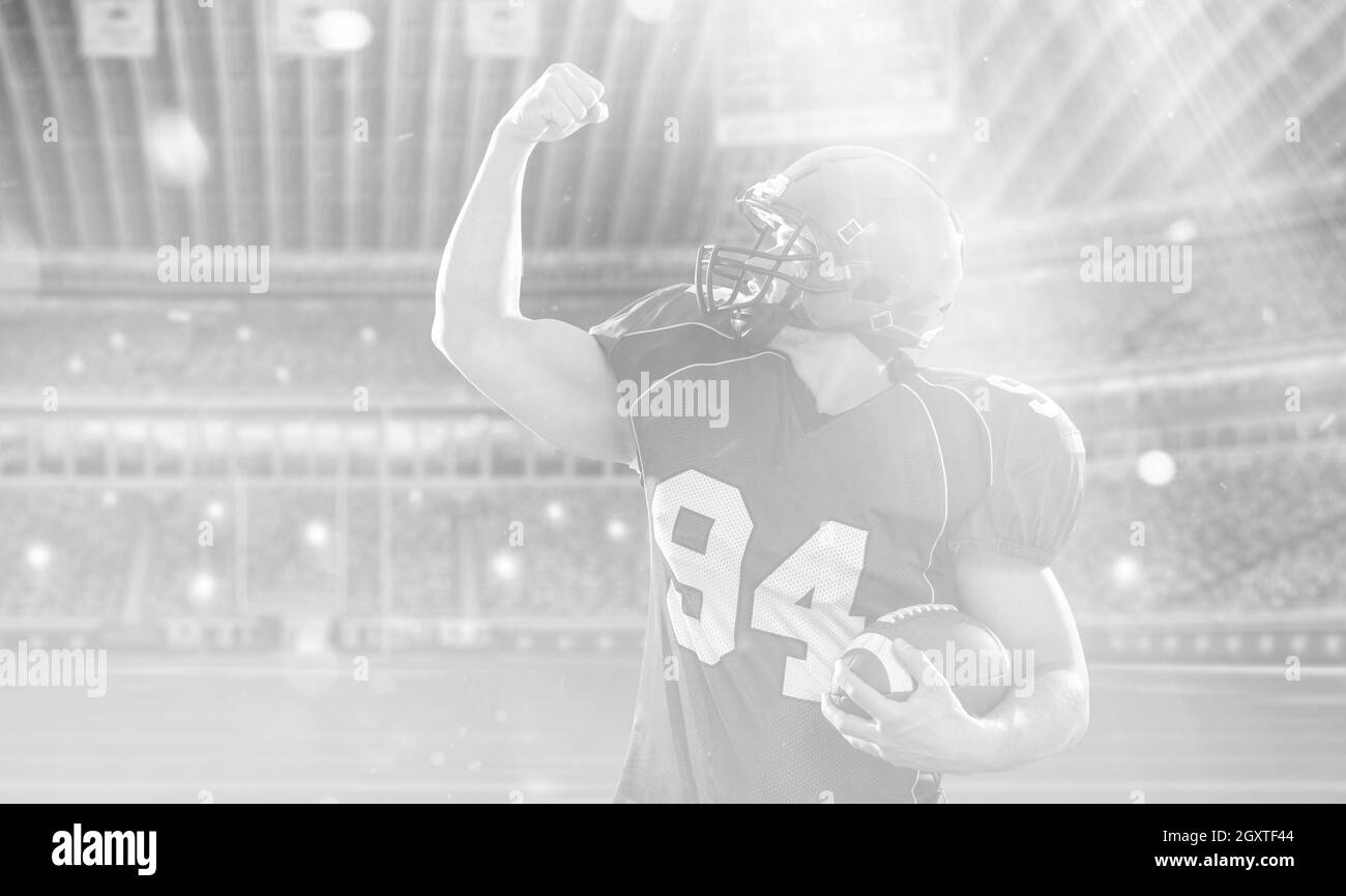 american football player celebrating touchdown on big modern stadium ...