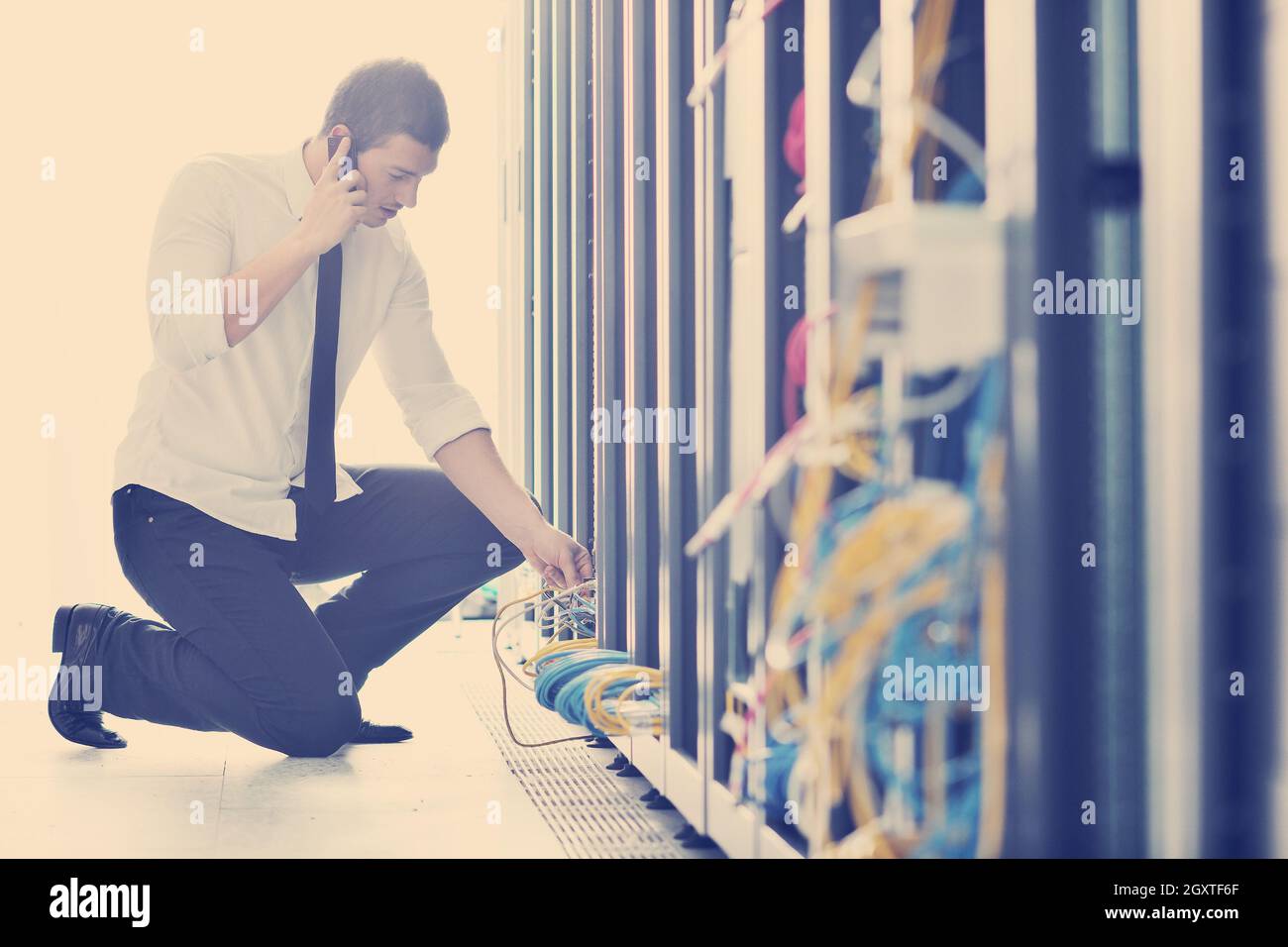 young business man computer science engeneer talking by cellphone at ...