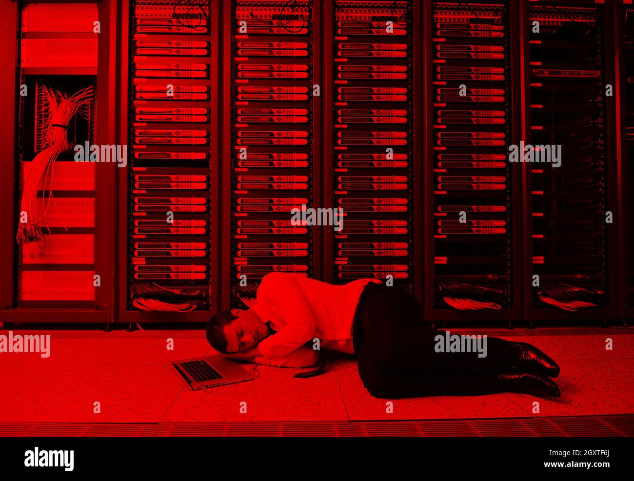 business man in network server room have problems and looking for ...