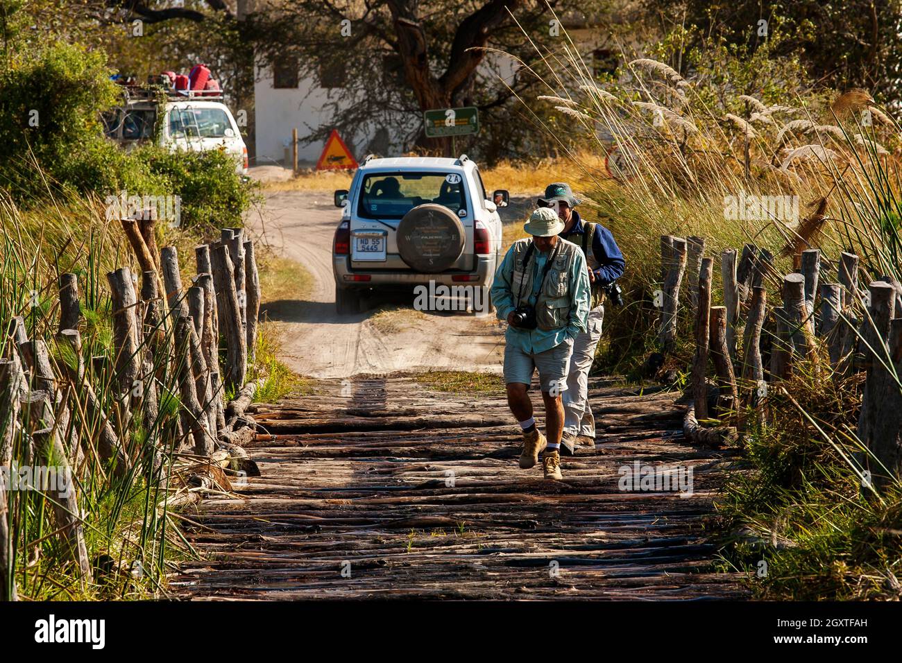 Safari car crossing the popular Third Bridge, Moremi Game Reserve ...