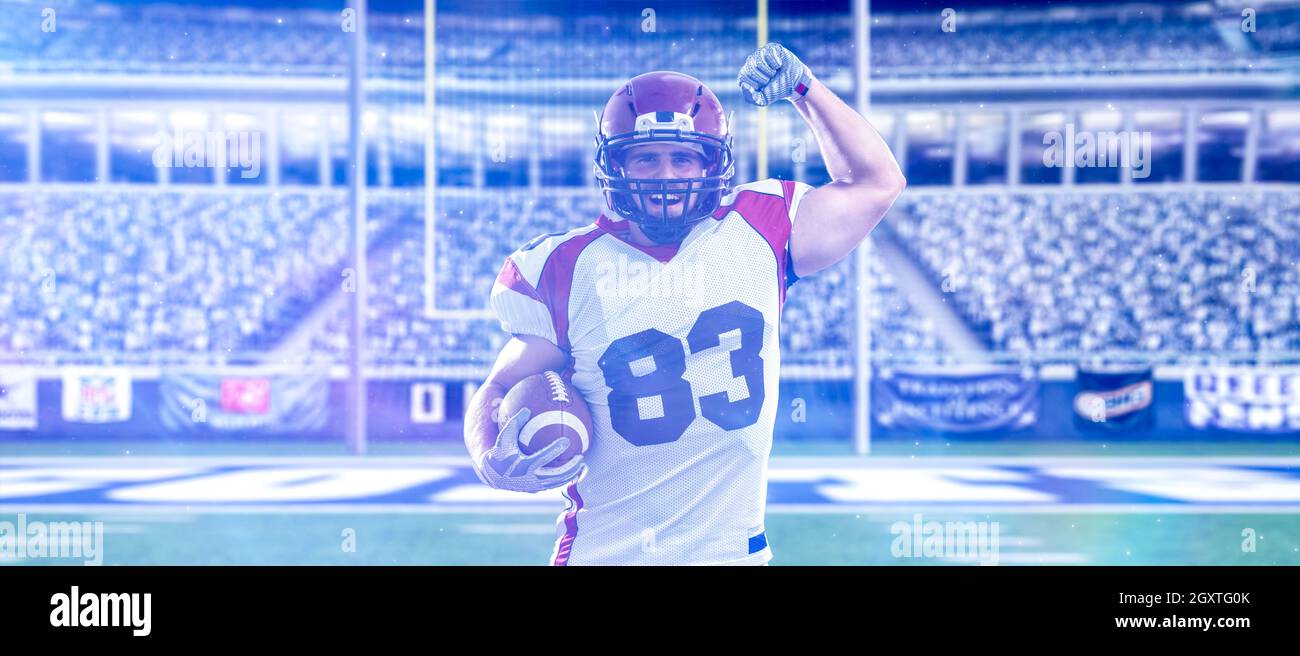 american football player celebrating touchdown on big modern stadium ...