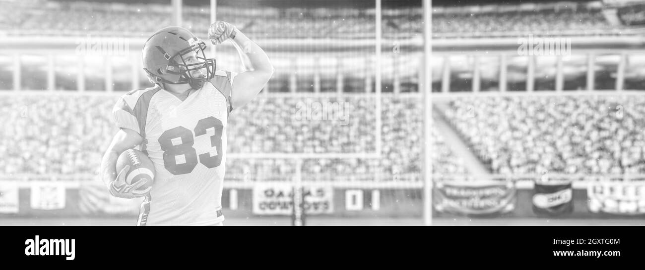 american football player celebrating touchdown on big modern stadium ...