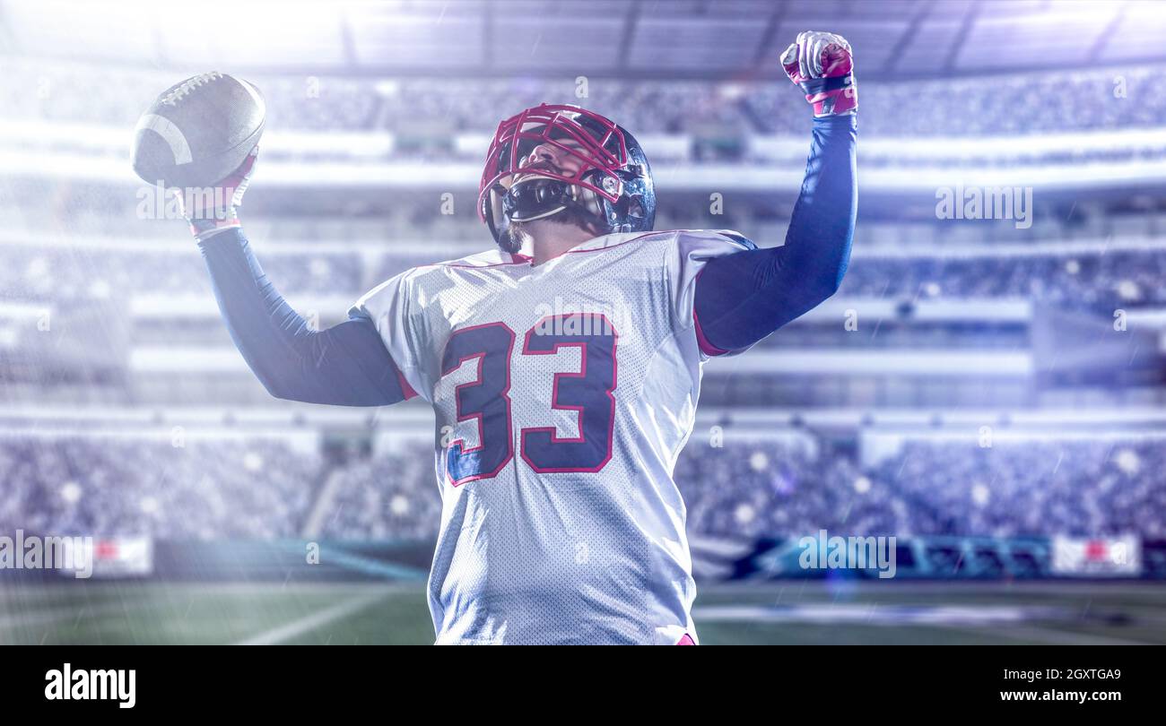 american football player celebrating after scoring a touchdown on big ...