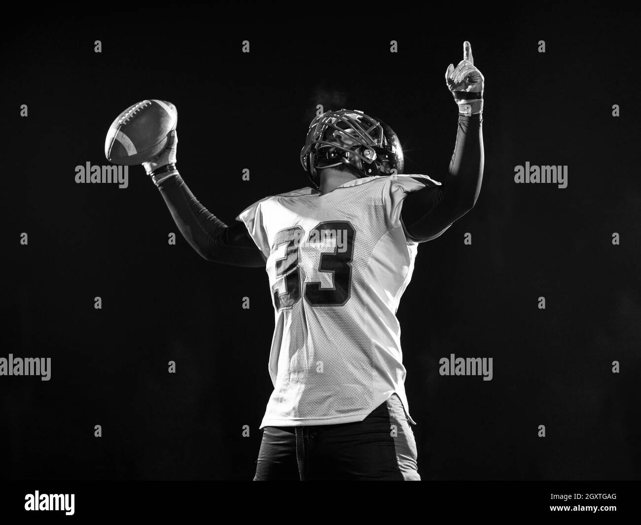 american football player celebrating after scoring a touchdown on field ...