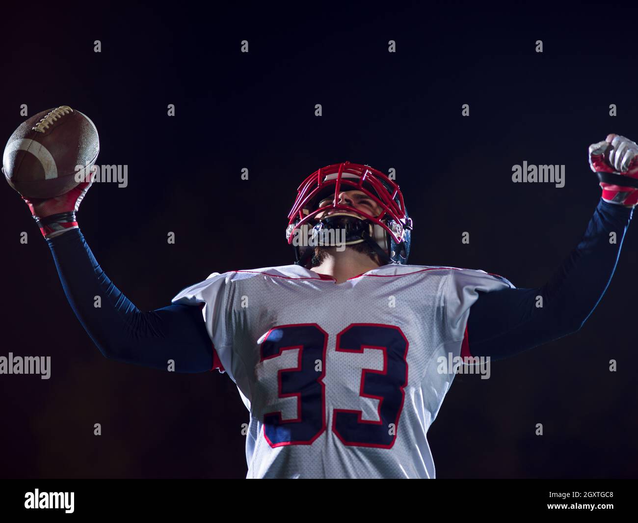 american football player celebrating after scoring a touchdown on field ...