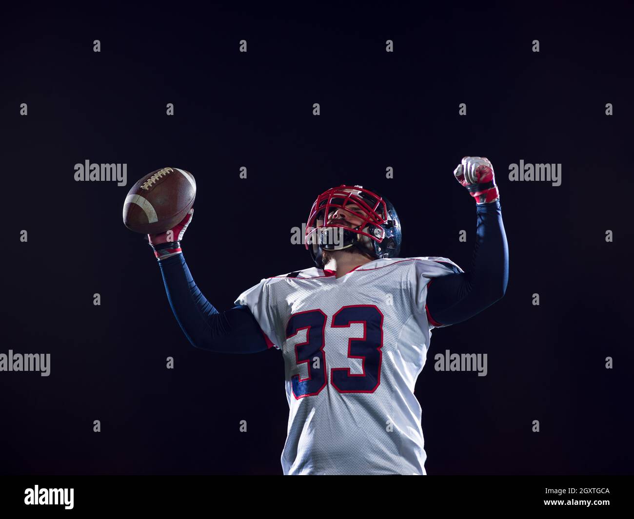 american football player celebrating after scoring a touchdown on field ...