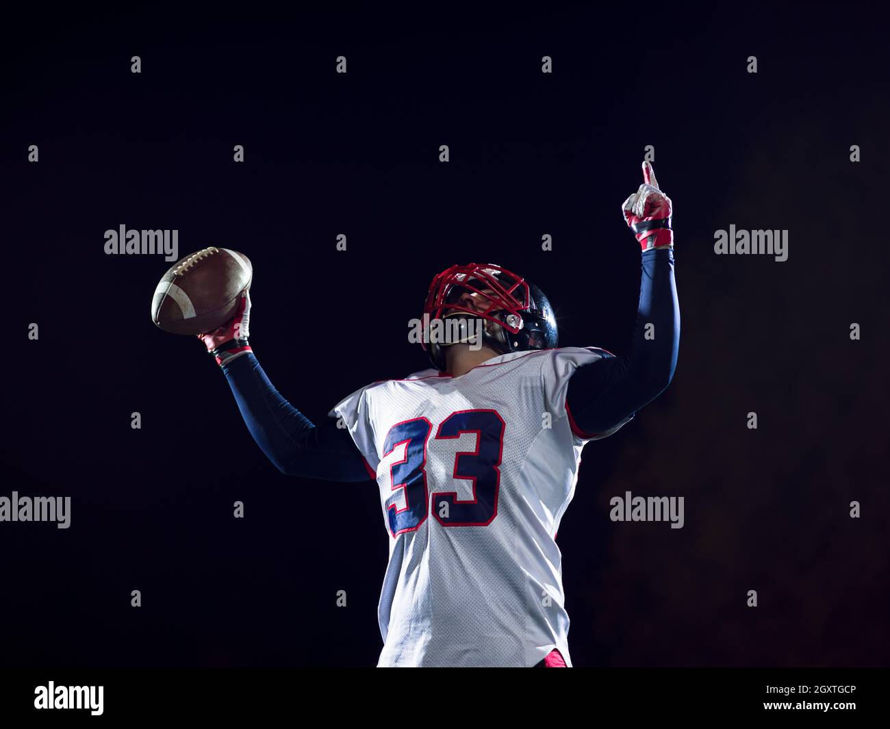 american football player celebrating after scoring a touchdown on field ...
