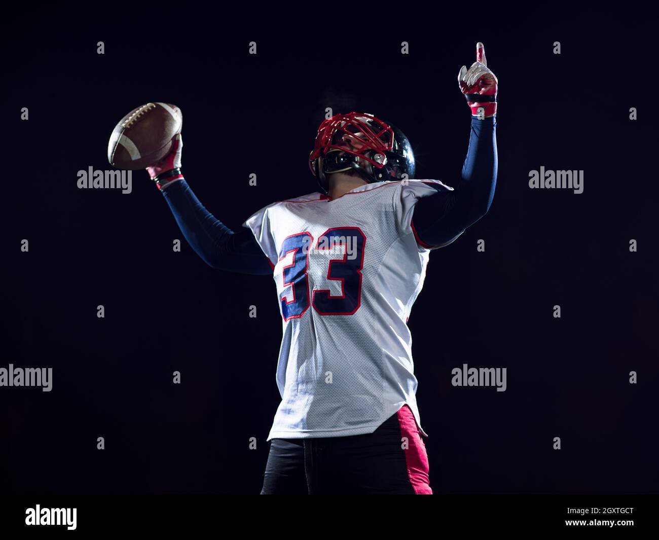 american football player celebrating after scoring a touchdown on field ...