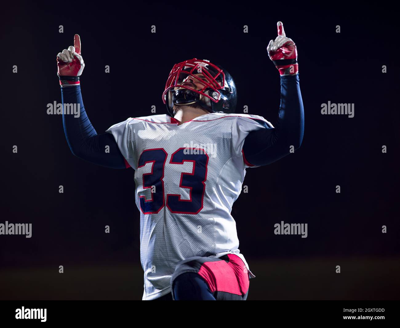 american football player celebrating after scoring a touchdown on field ...