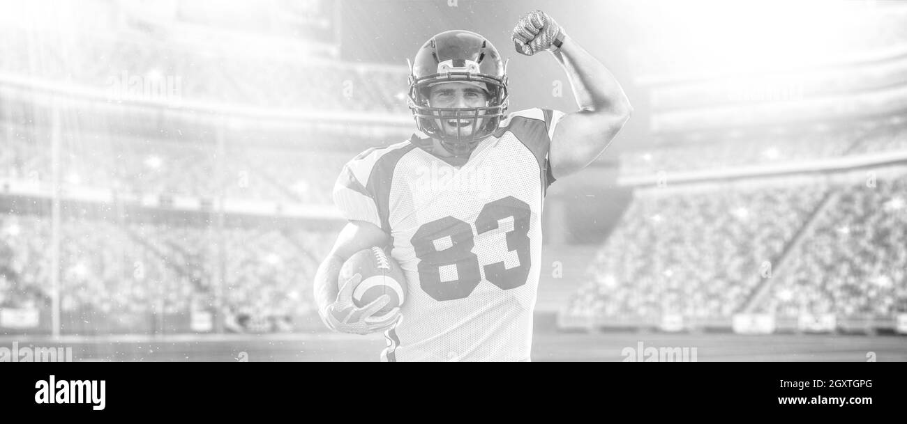 american football player celebrating touchdown on big modern stadium ...