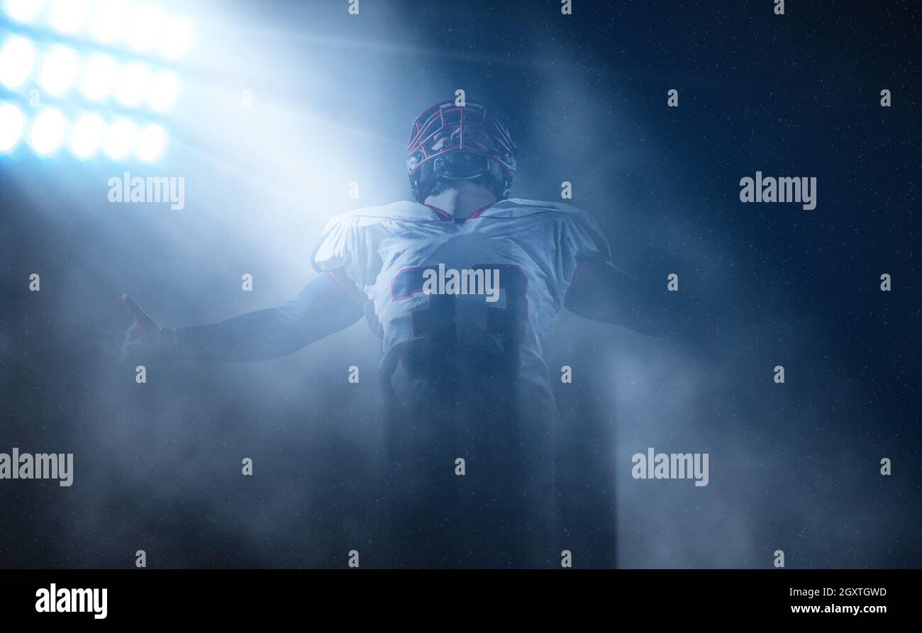 american football player celebrating after scoring a touchdown on field ...
