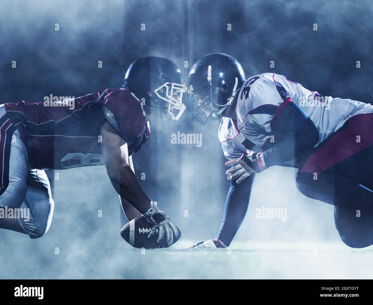 american football players are ready to start a match on modern field at ...