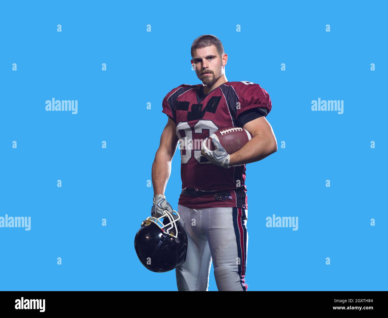 Portrait of a strong muscular American Football Player isolated on ...