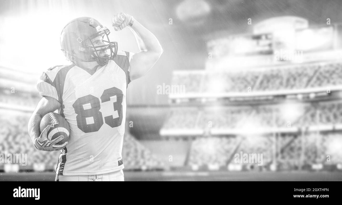 american football player celebrating touchdown on big modern stadium ...