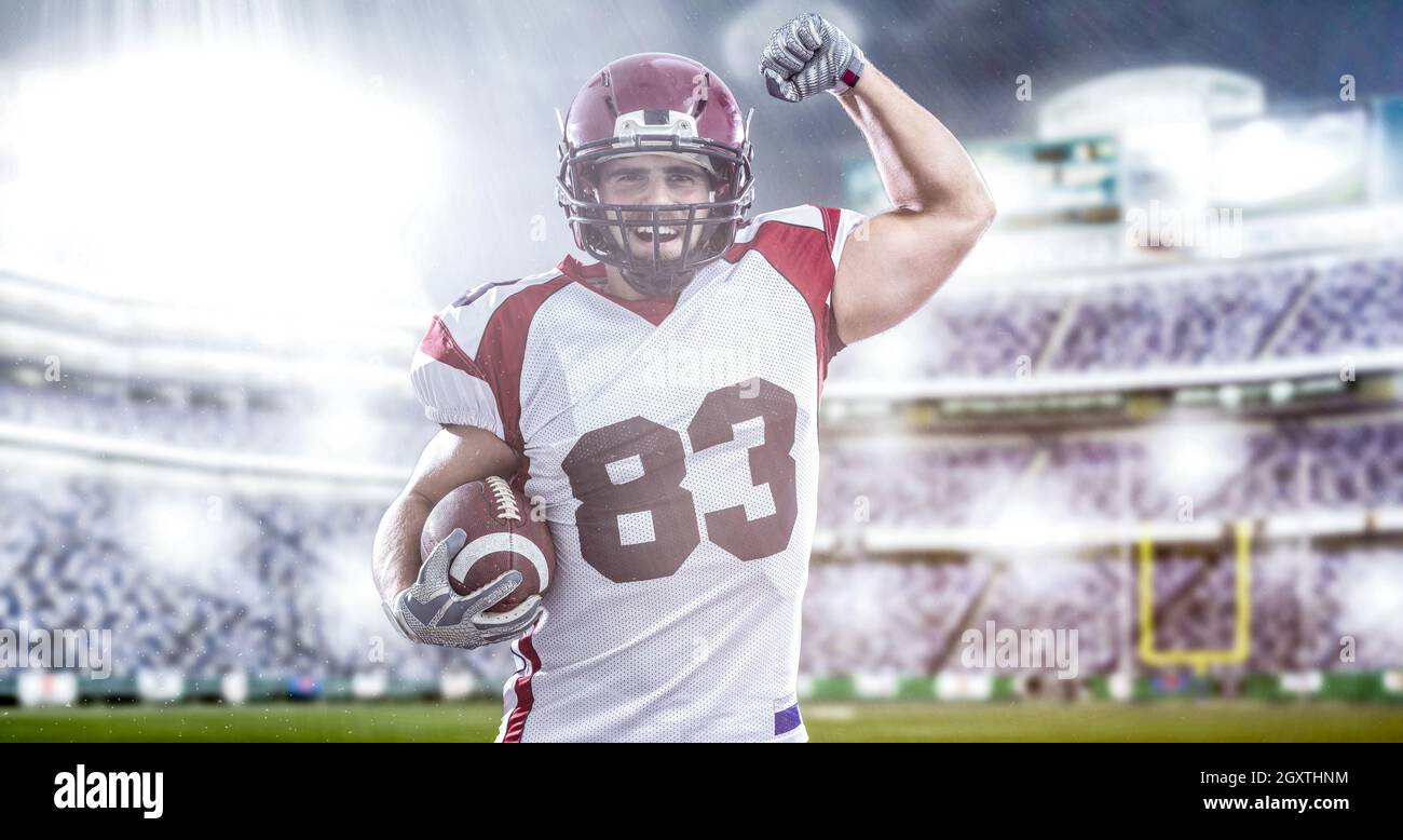 american football player celebrating touchdown on big modern stadium ...