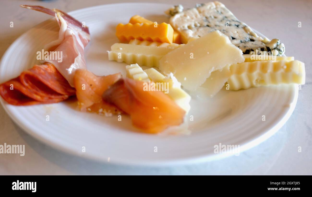 Deli Cheese Plate with Cold Cuts and Fish Stock Photo - Alamy