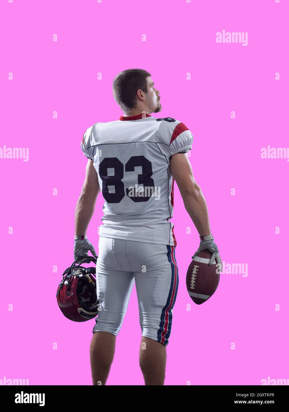 Portrait of a strong muscular American Football Player isolated on ...