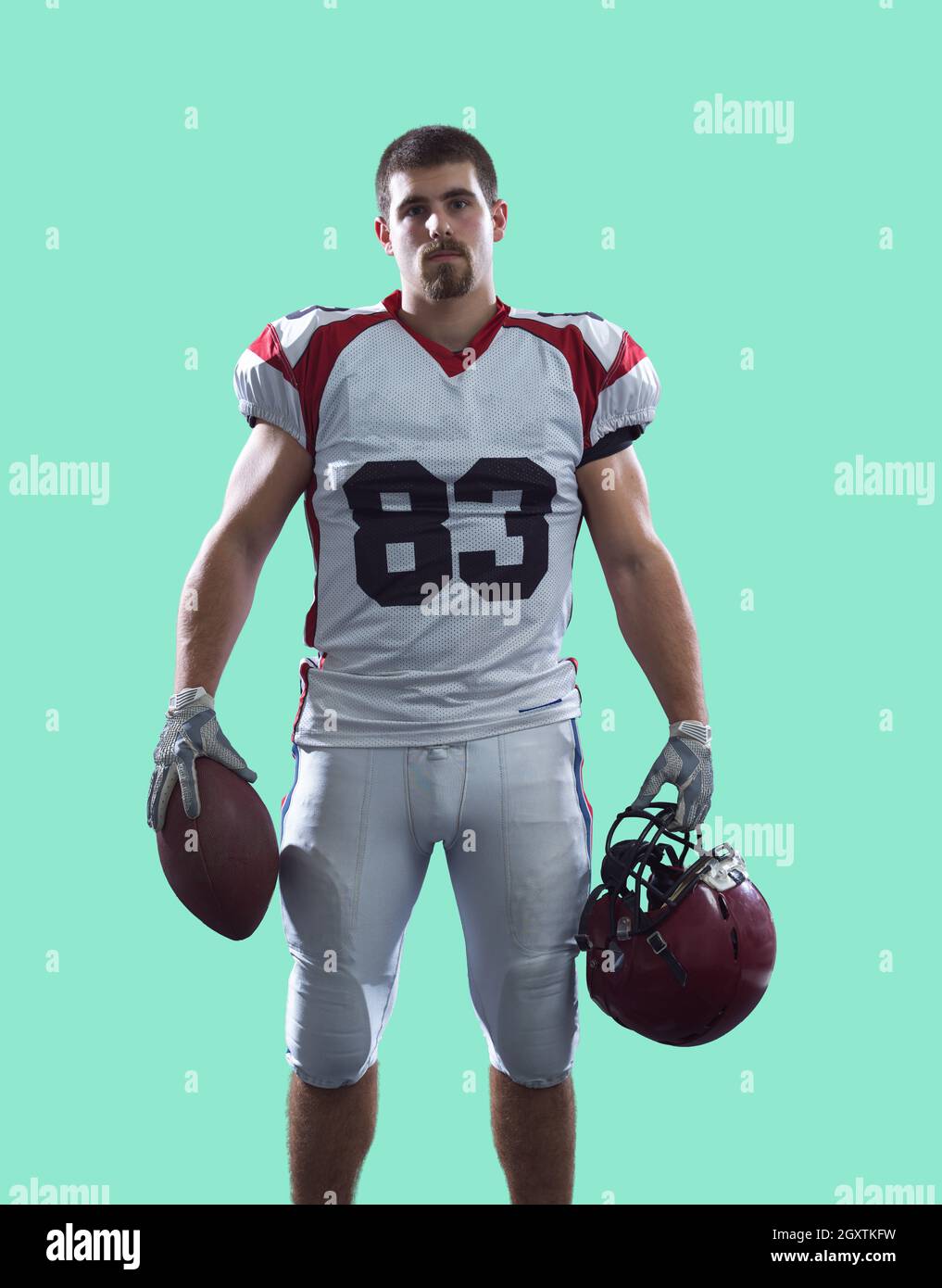 Portrait of a strong muscular American Football Player isolated on ...
