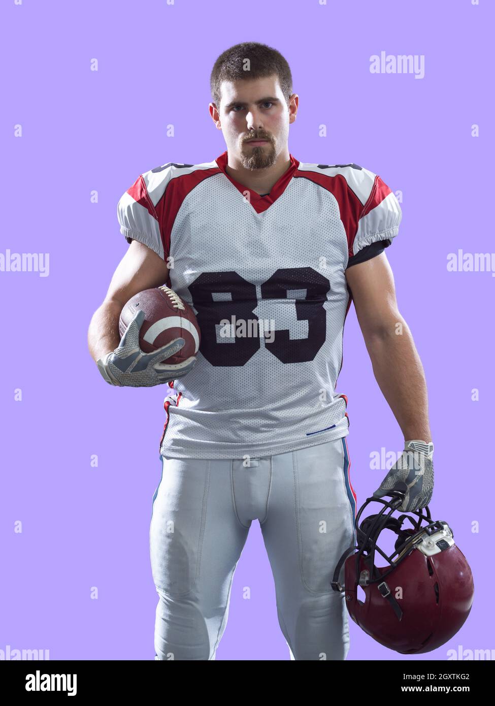 Portrait of a strong muscular American Football Player isolated on ...