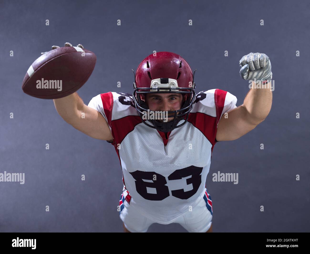 american football player celebrating touchdown isolated on gray ...