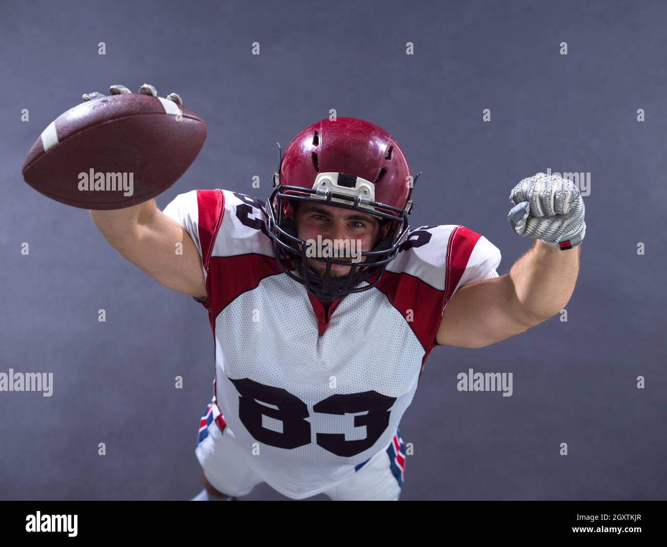 american football player celebrating touchdown isolated on gray ...