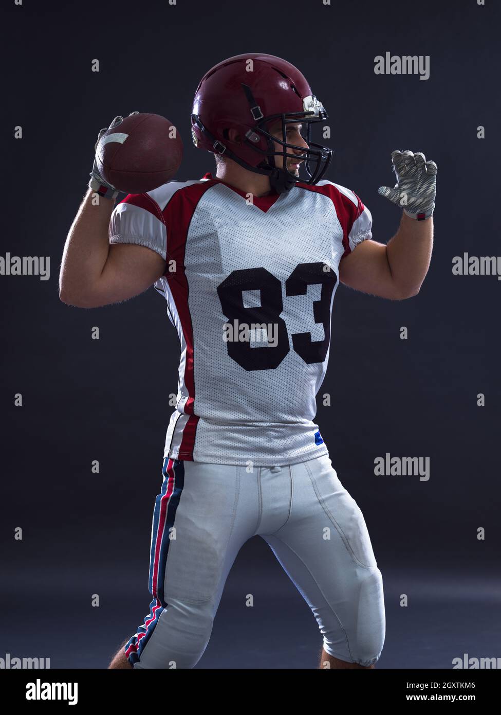 one quarterback american football player throwing ball isolated on gray ...