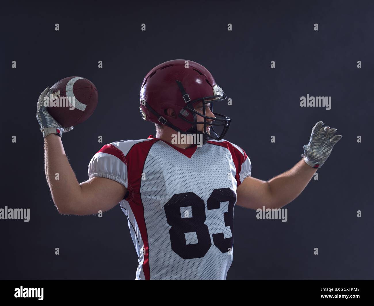 one quarterback american football player throwing ball isolated on gray ...