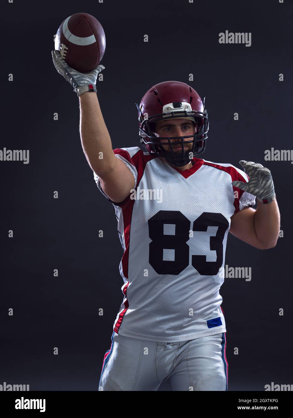 one quarterback american football player throwing ball isolated on gray ...