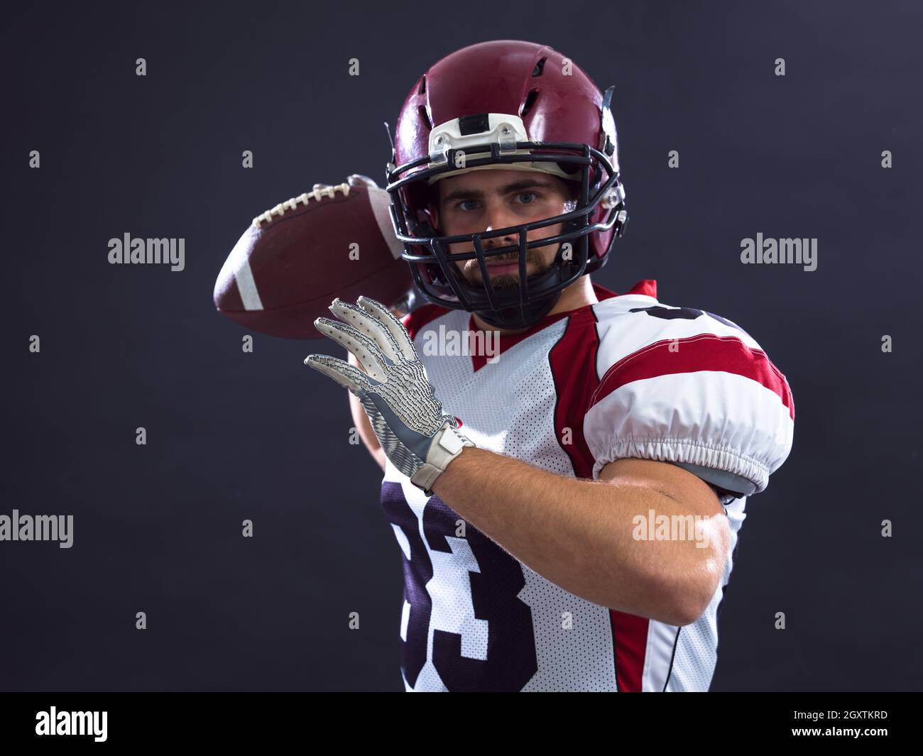 one quarterback american football player throwing ball isolated on gray ...