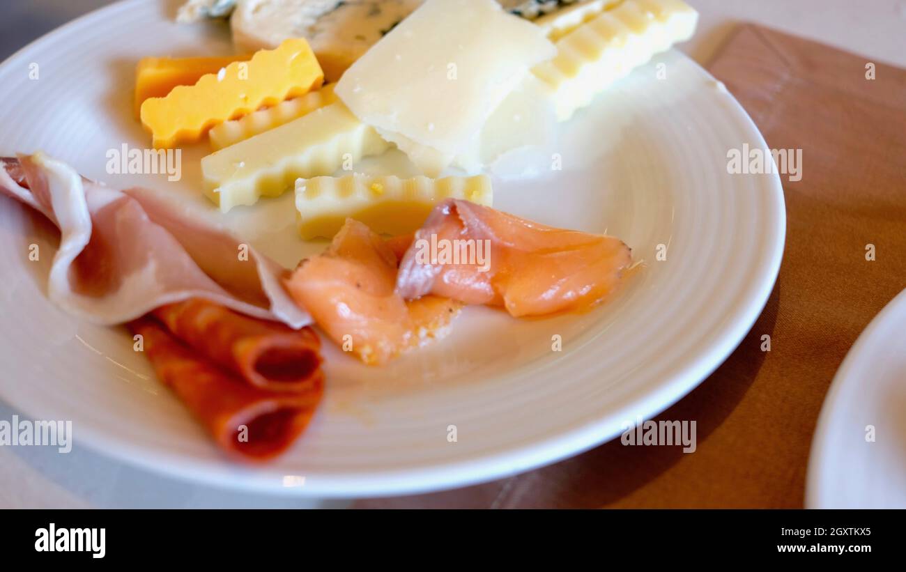 Deli Cheese Plate with Cold Cuts and Fish Charcuterie Stock Photo - Alamy