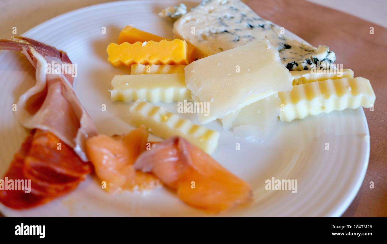 Deli Cheese Plate with Cold Cuts and Fish Charcuterie Stock Photo - Alamy