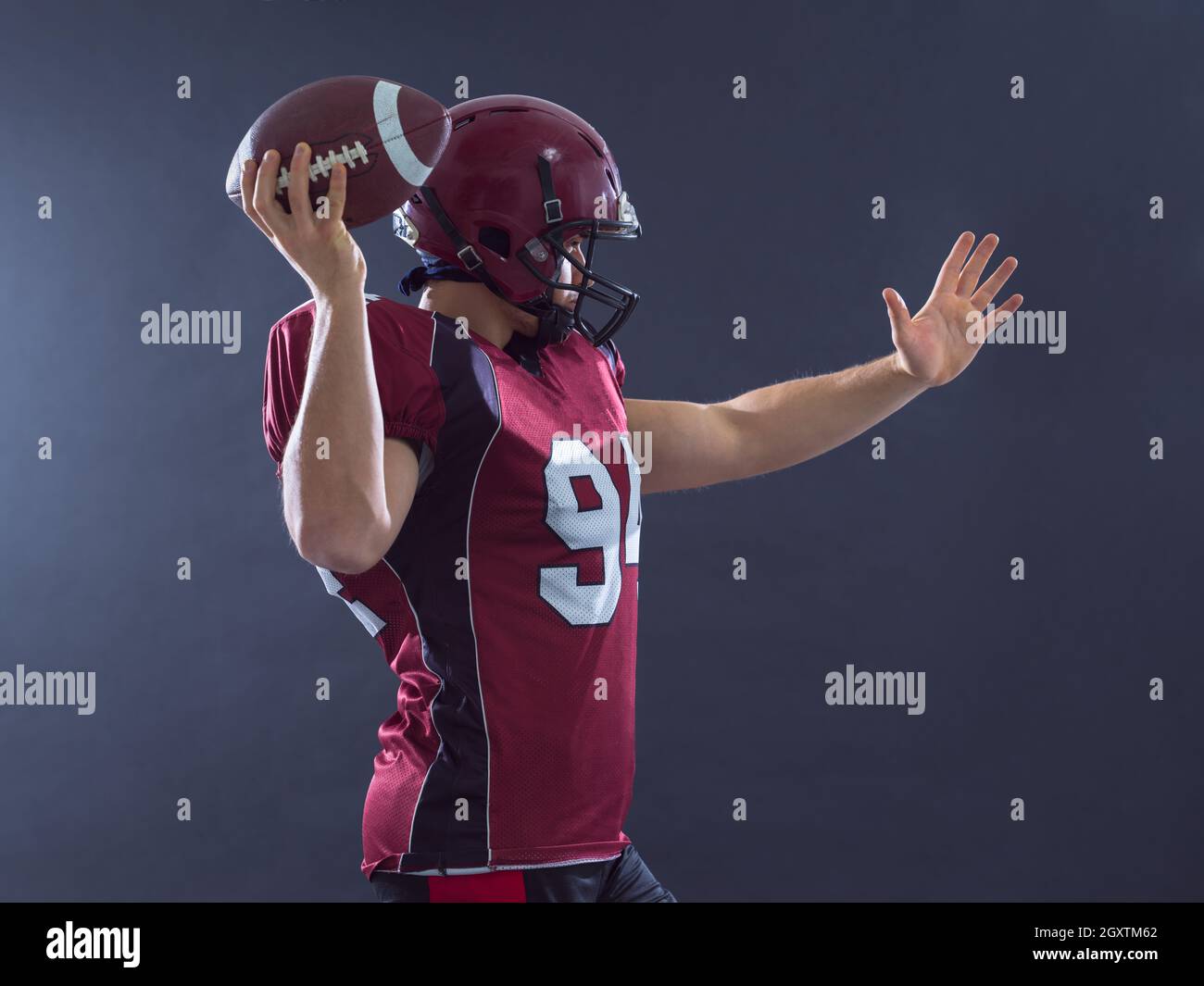 one quarterback american football player throwing ball isolated on gray ...