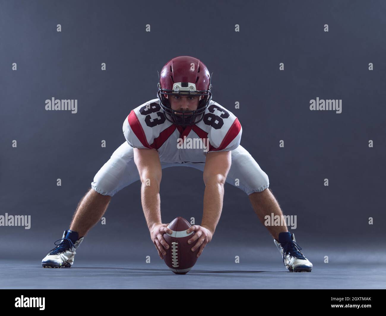 American football player getting ready before starting the game while ...