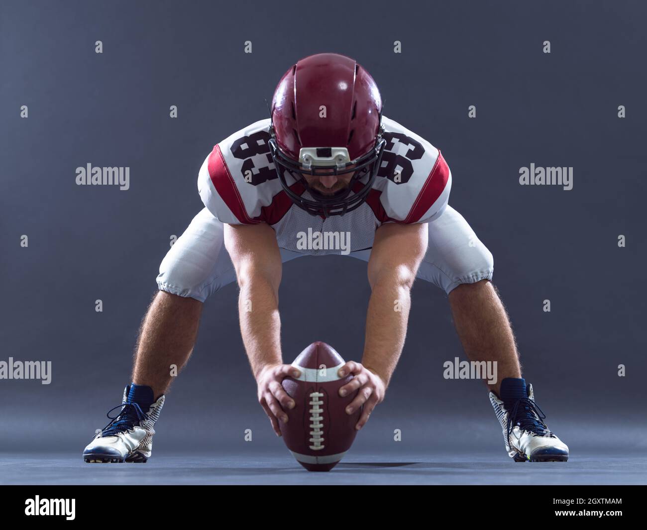 American football player getting ready before starting the game while ...