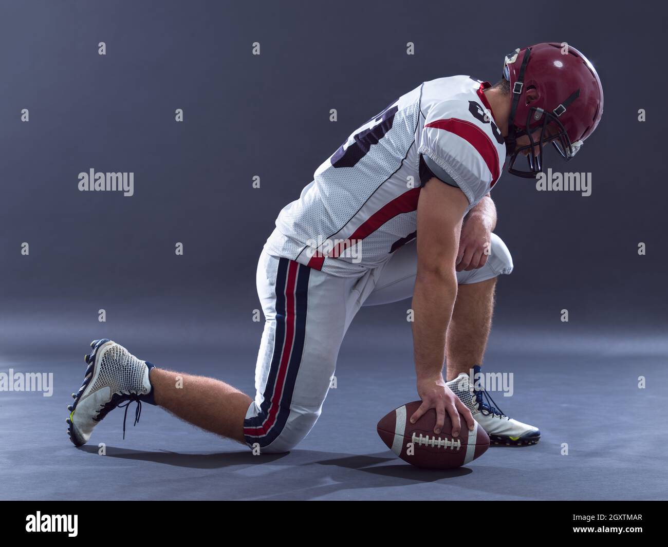 American football player getting ready before starting the game while ...