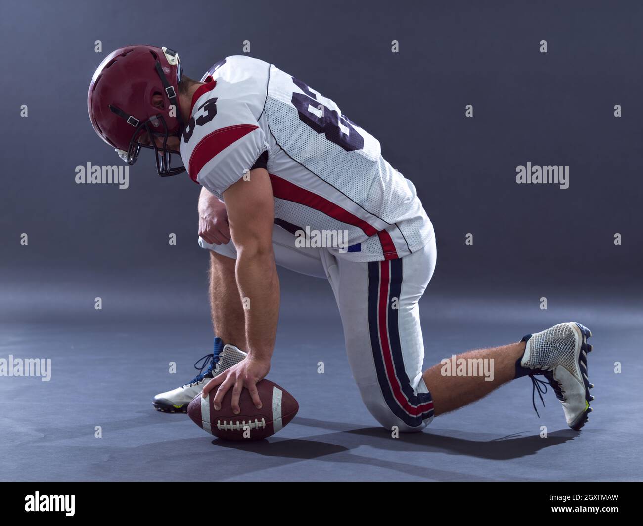 American football player getting ready before starting the game while ...