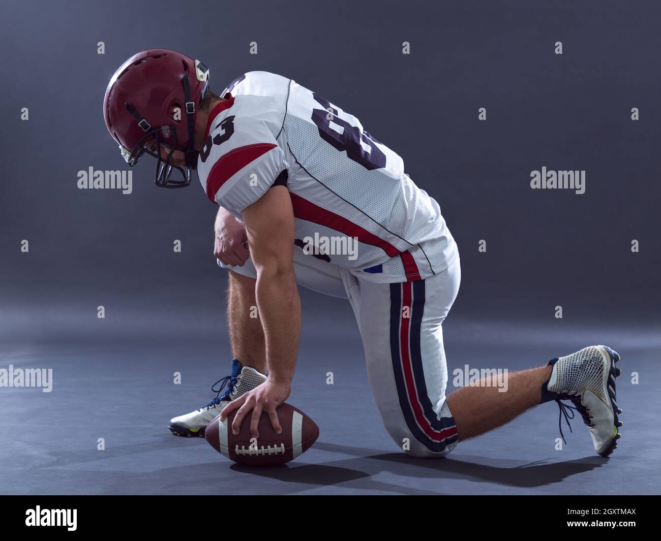 American football player getting ready before starting the game while ...