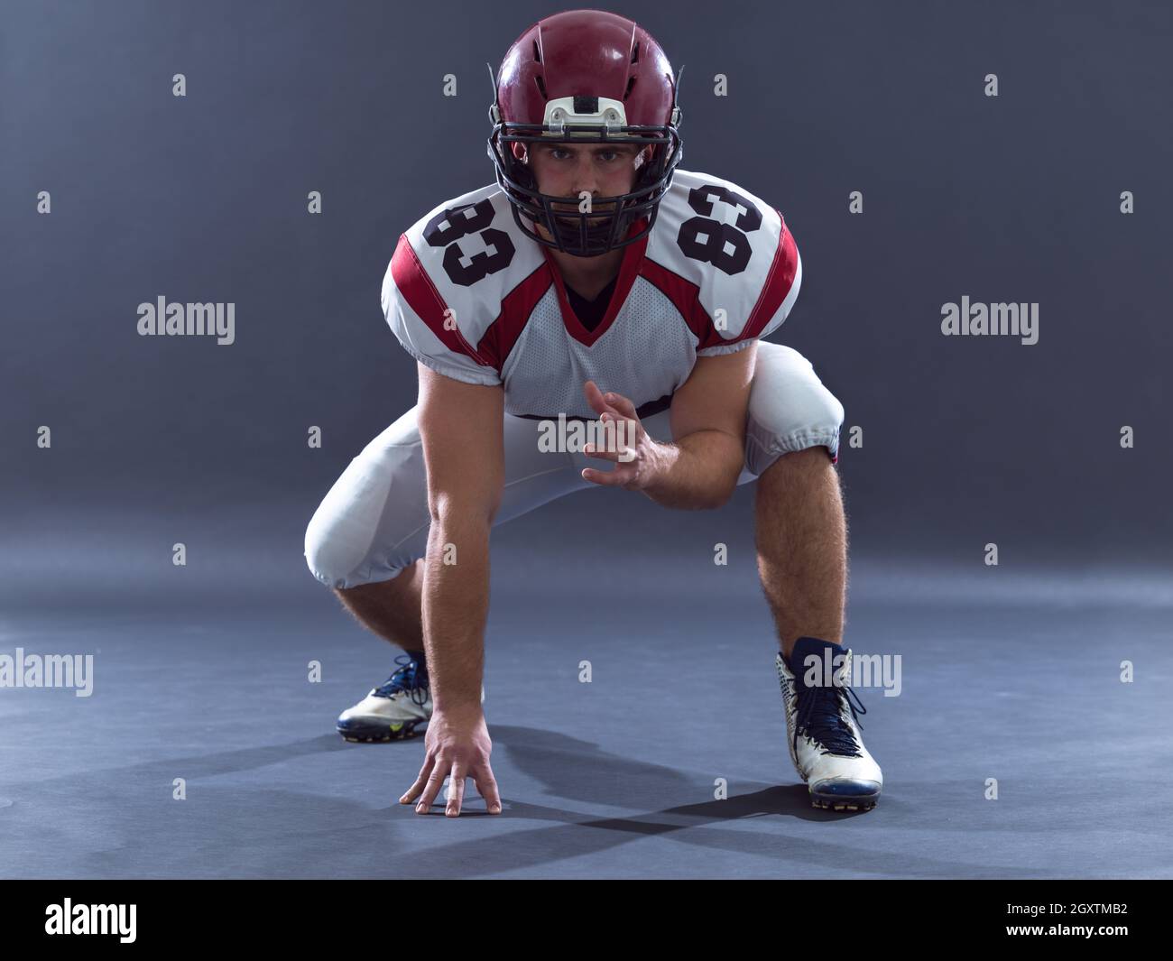 American football player getting ready before starting the game while ...