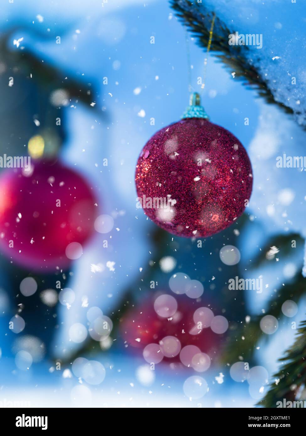 christmas tree red ball decoration with real snow Stock Photo - Alamy