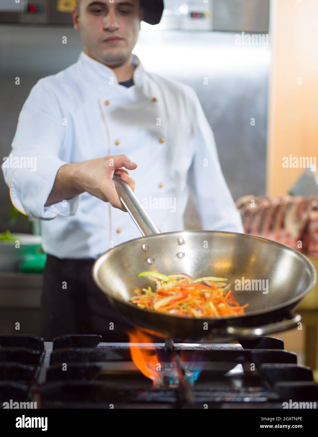 Chef working flaming pan hi-res stock photography and images - Alamy