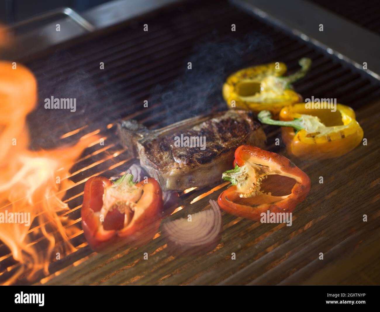 delicious grilled meat steak with vegetables on a barbecue Stock Photo ...