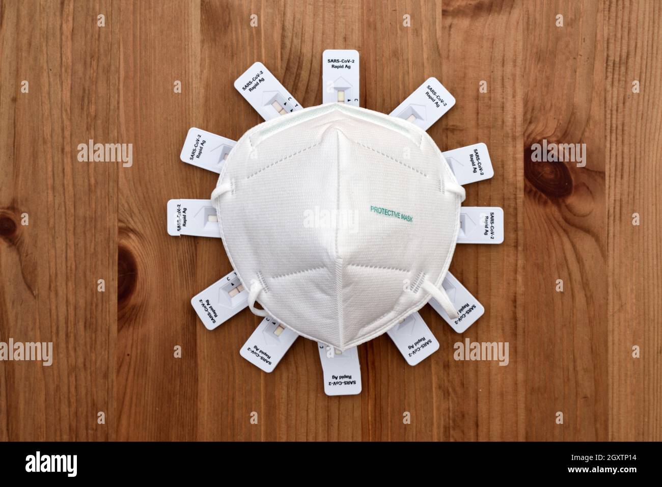 Corona virus symbolized by protective ffp2 face mask and rapid antigen ...