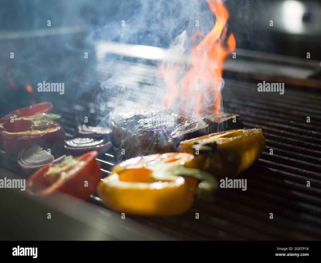 delicious grilled meat steak with vegetables on a barbecue Stock Photo ...
