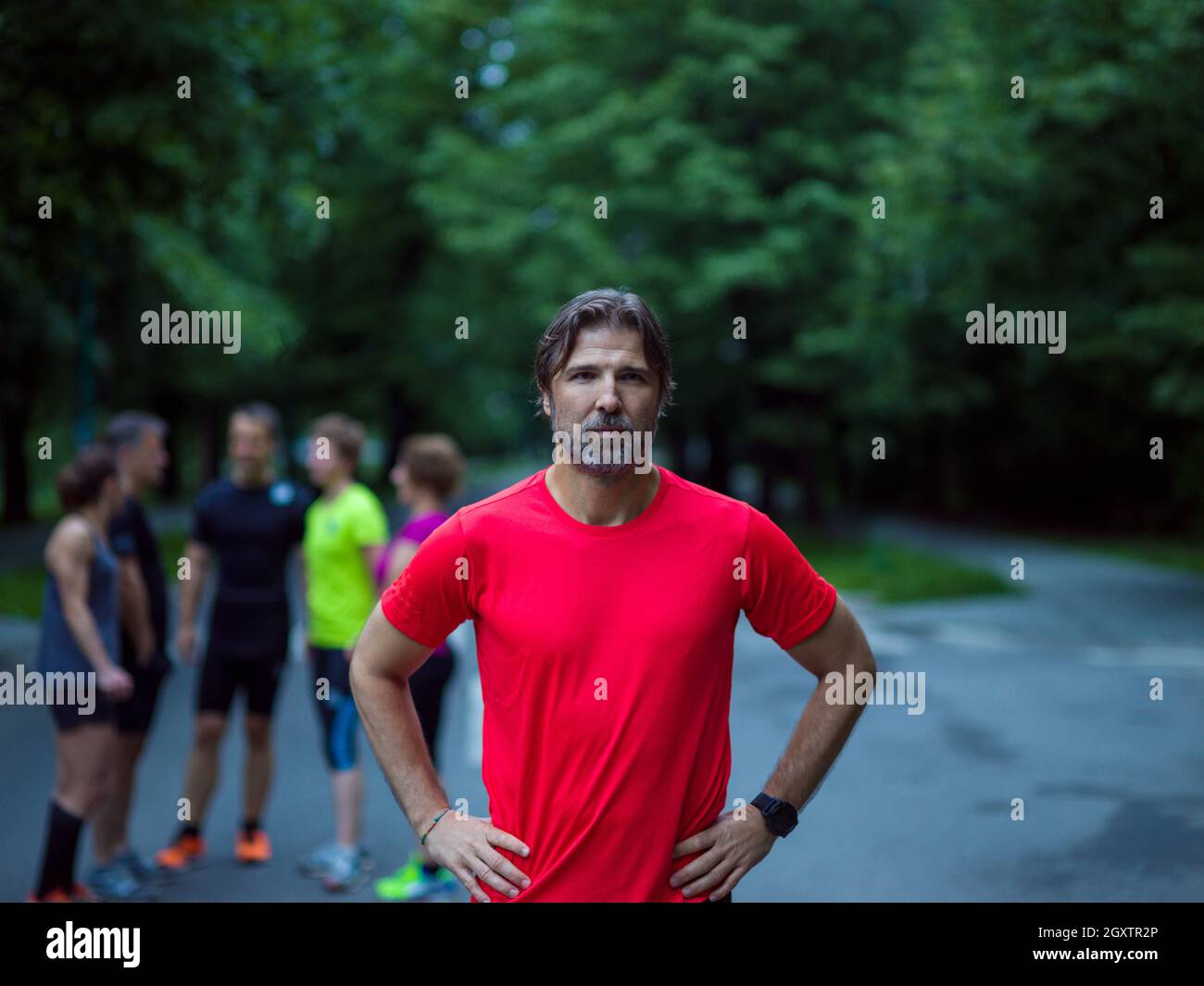 portrait of fit muscular male runner training for marathon running on ...