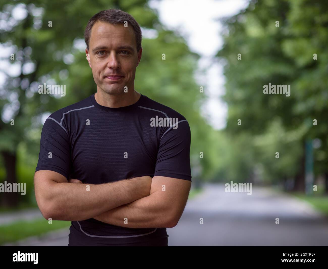 portrait of fit muscular male runner training for marathon running on ...
